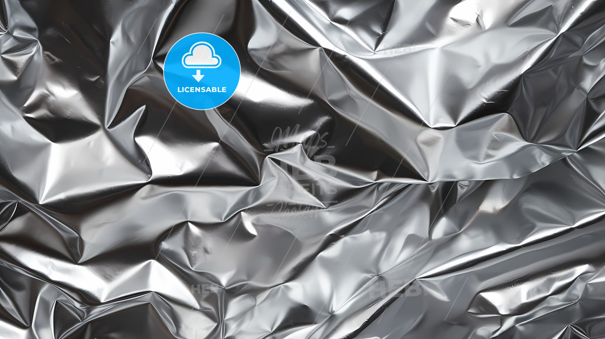 A Close Up Of A Crumpled Silver Foil - HEBSTREITS Stock Image